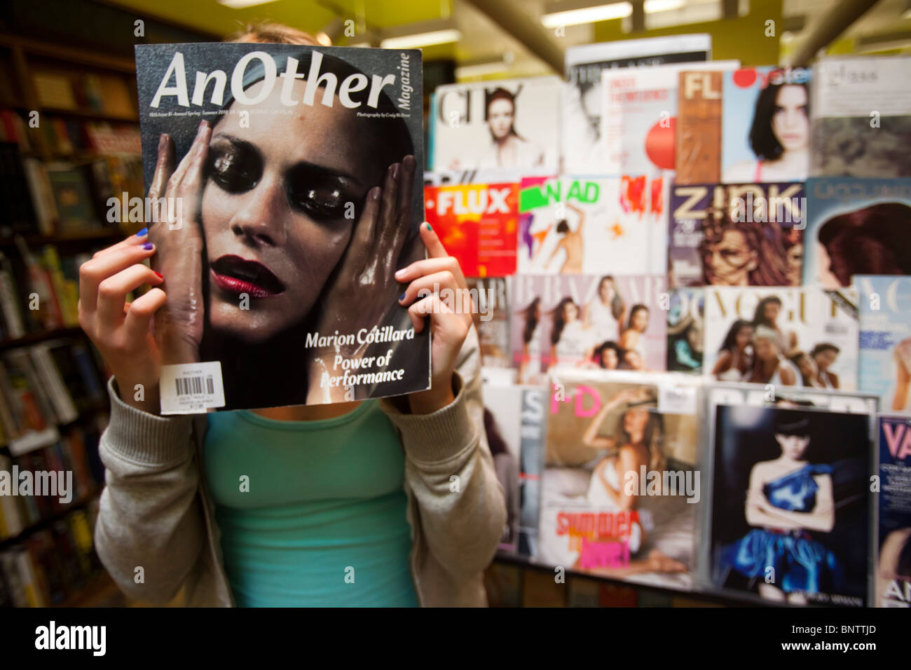 An adolescent reading a girl's magazine California, United States of ...