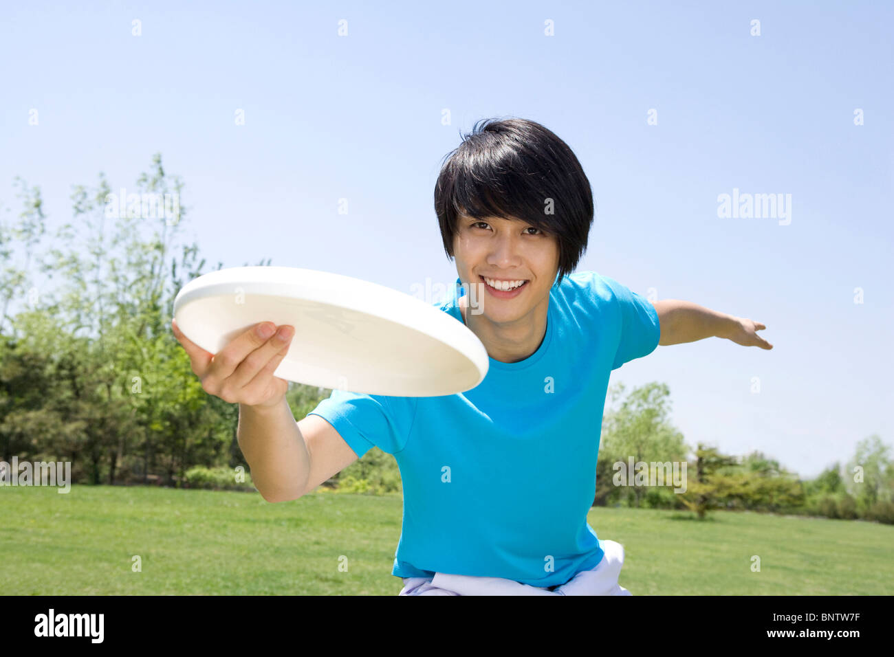 Man and frisbee and front view hi-res stock photography and images - Alamy