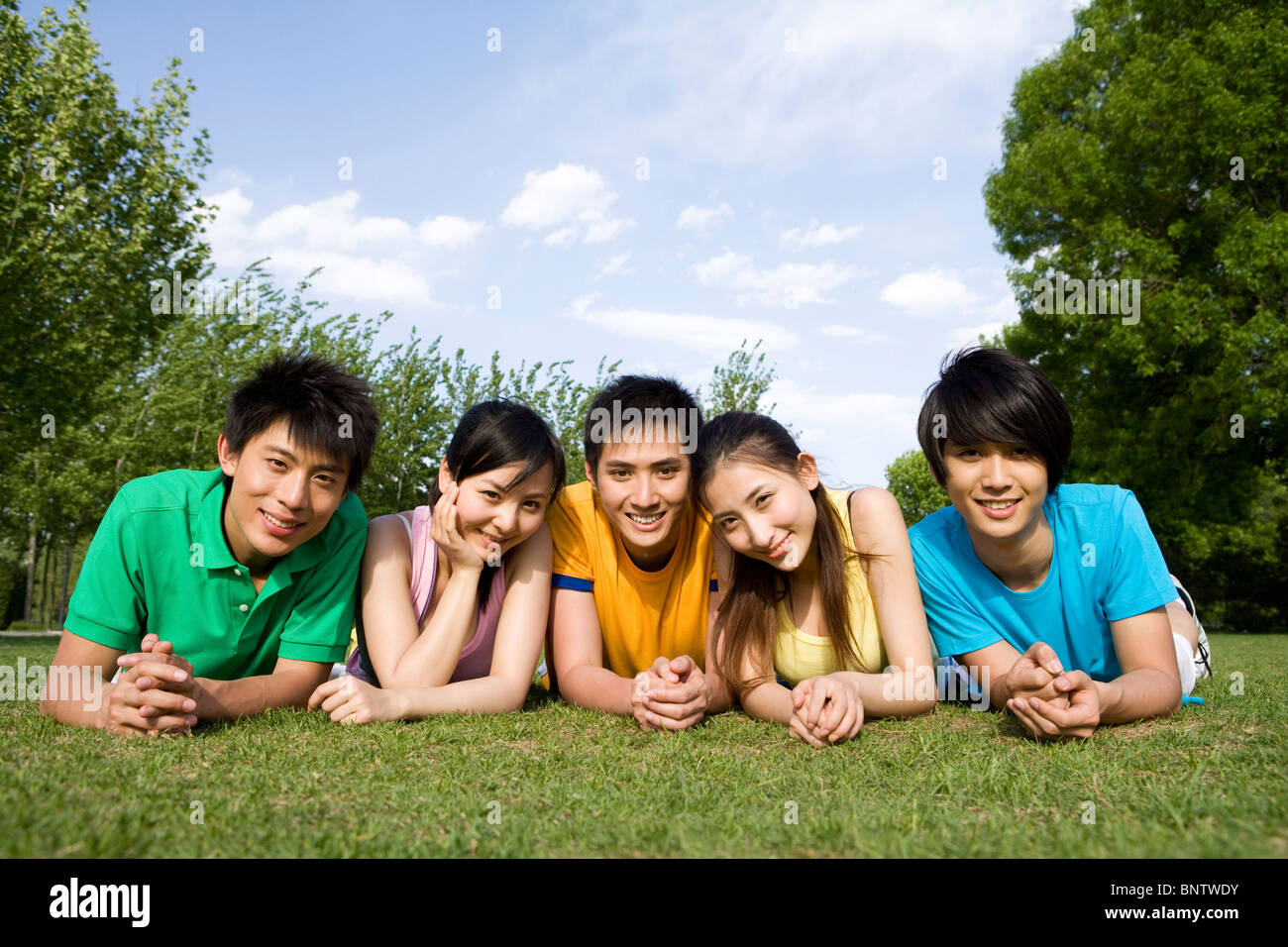 Portrait of friends at the park Stock Photo - Alamy