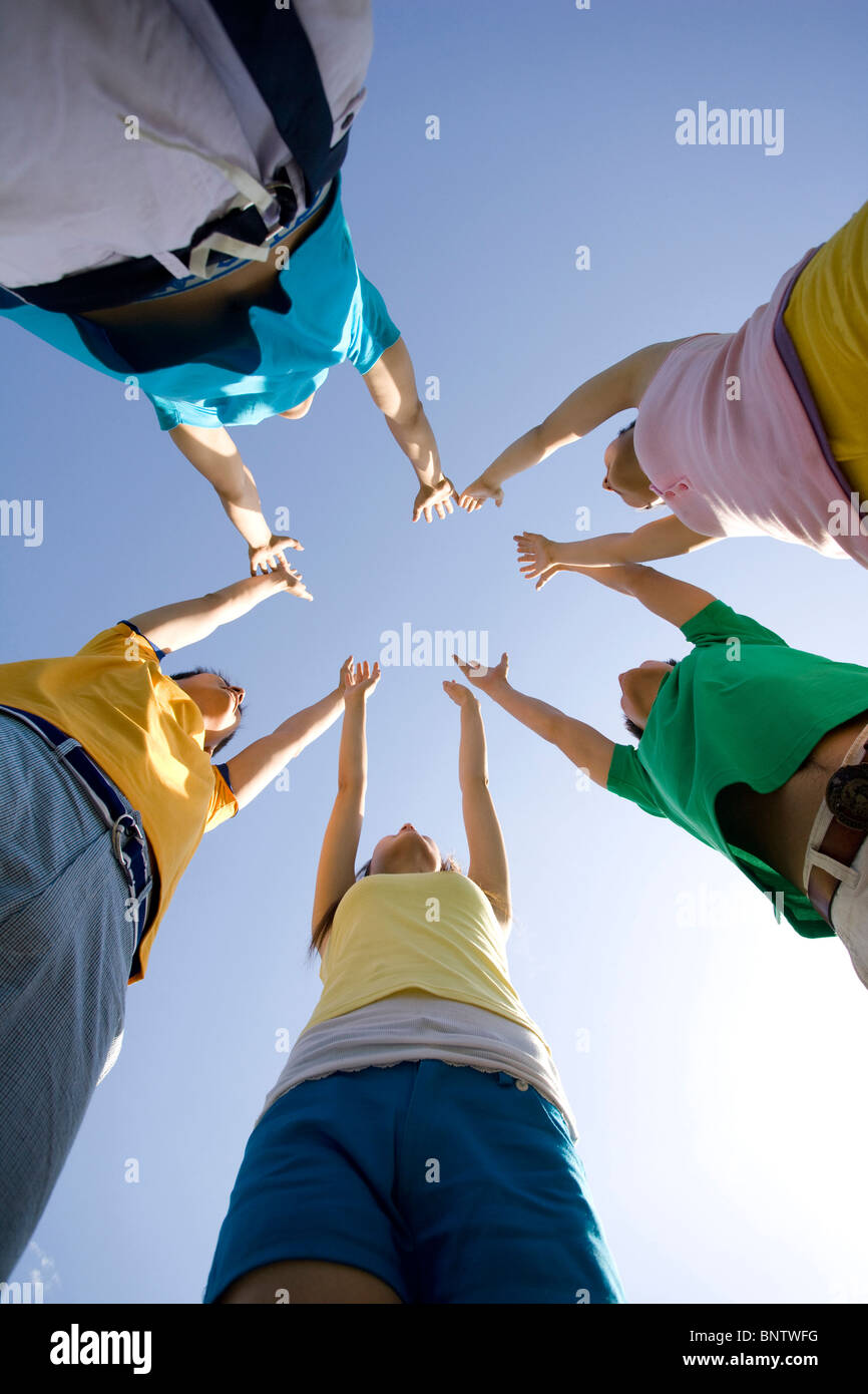 A group of young people in a circle Stock Photo - Alamy