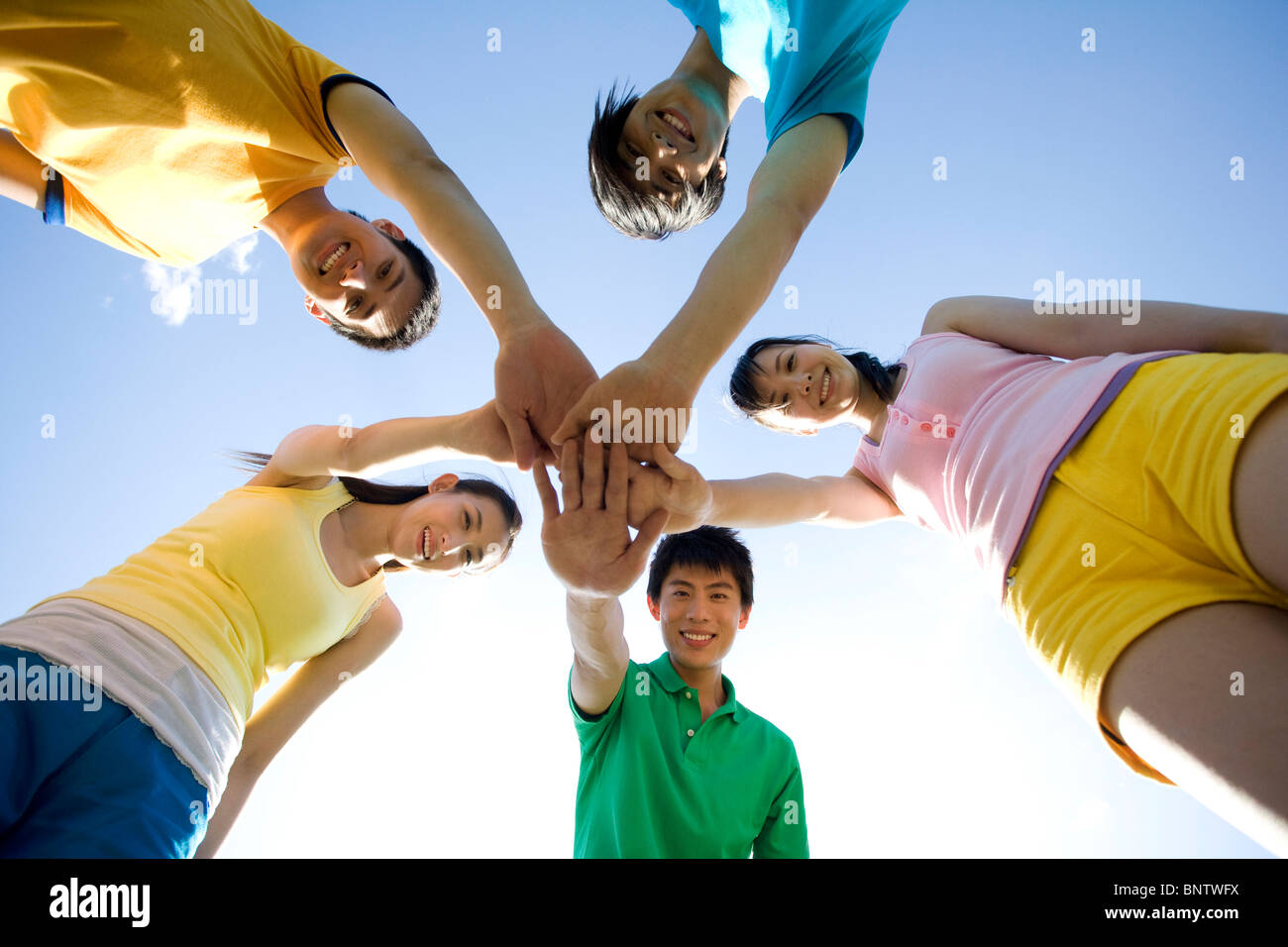 A group of young people in a circle Stock Photo - Alamy
