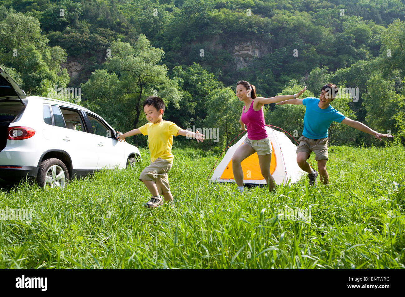 Family on a camping trip Stock Photo - Alamy