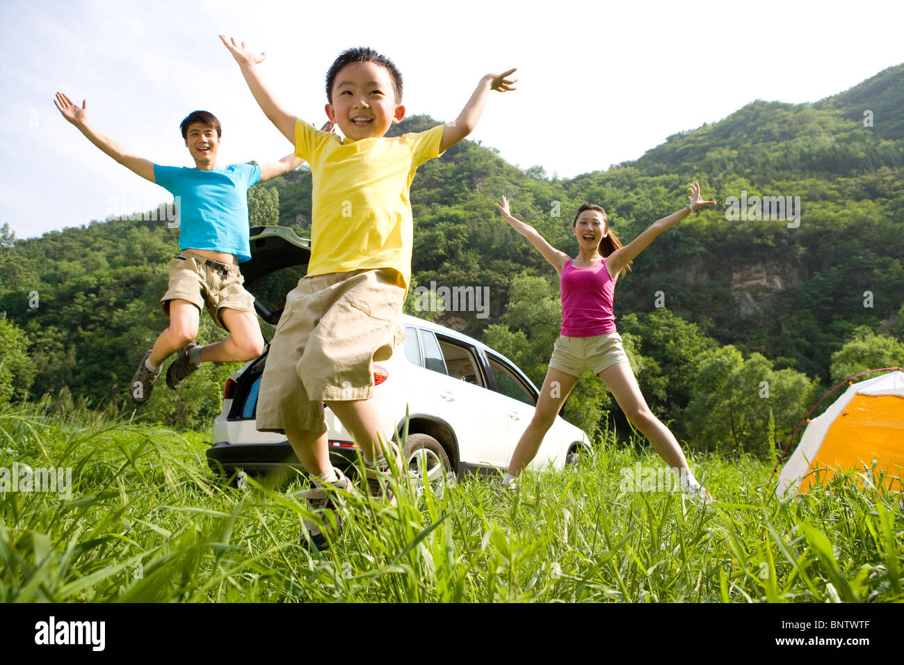 Family on a camping trip Stock Photo - Alamy