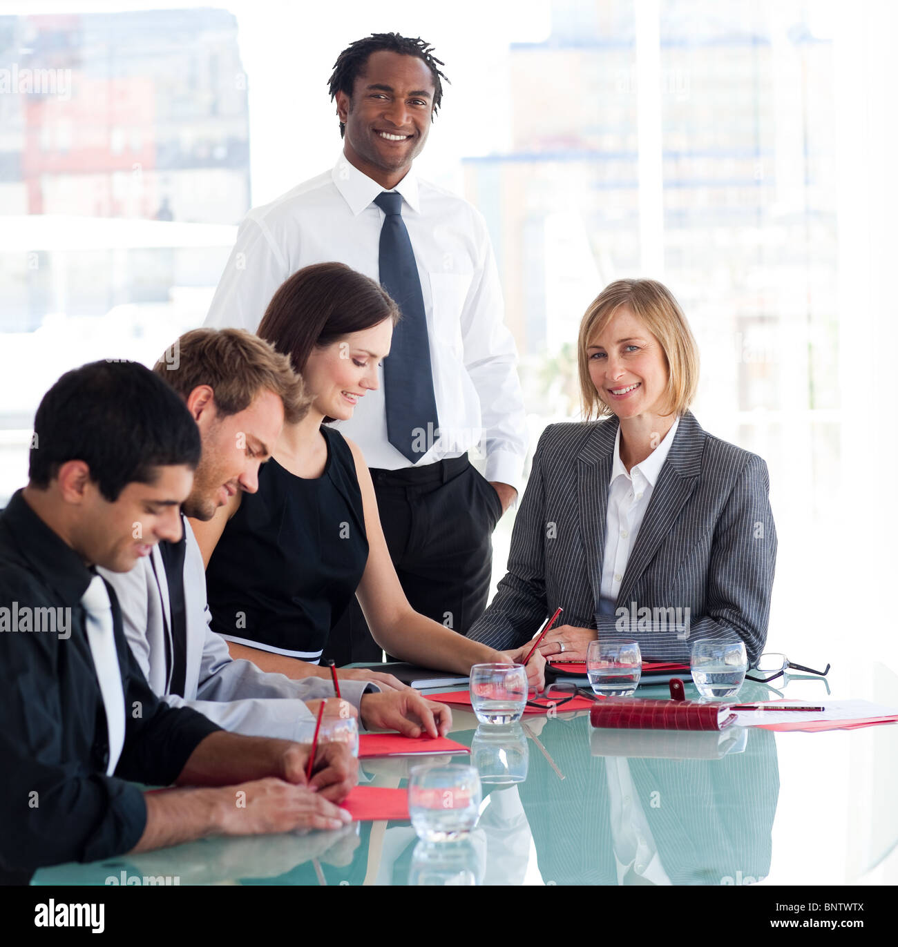 Businessman working with his team Stock Photo - Alamy