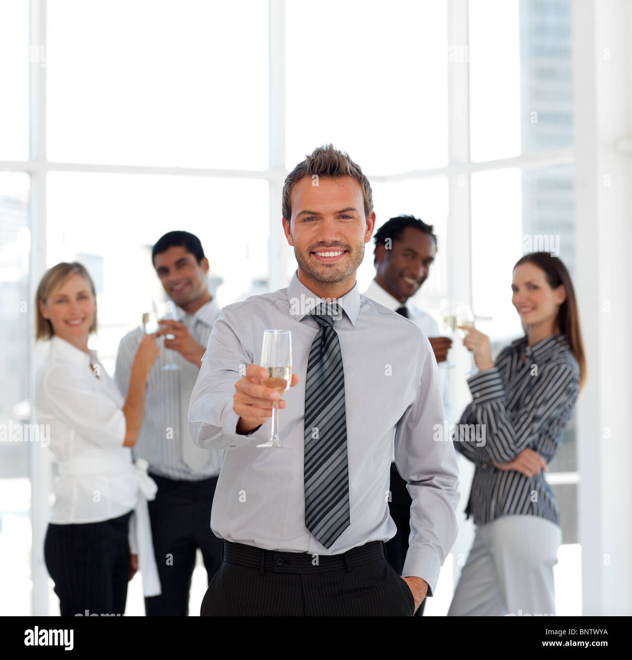 Sucessful Business team drinking champagne Stock Photo - Alamy
