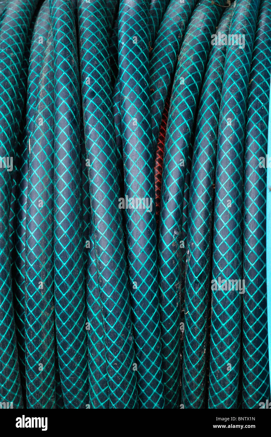 Roll up hose hi-res stock photography and images - Alamy