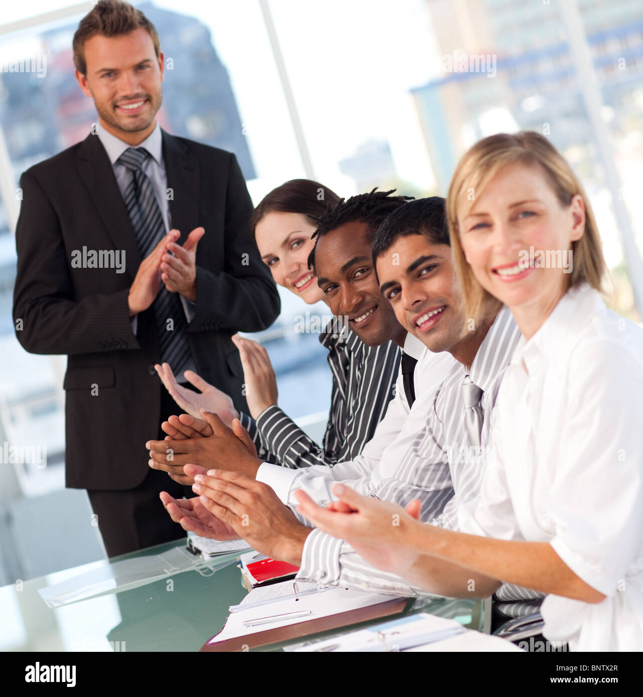 International business team clapping at the end of a presentation Stock ...