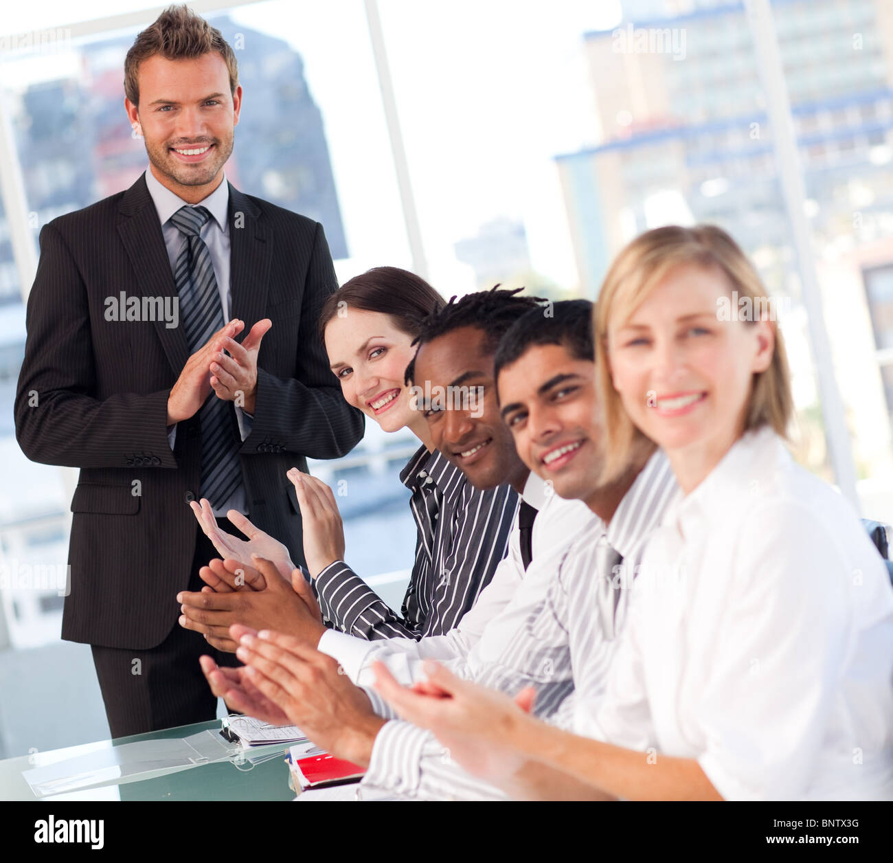 Happy Business team after a presentation Stock Photo - Alamy