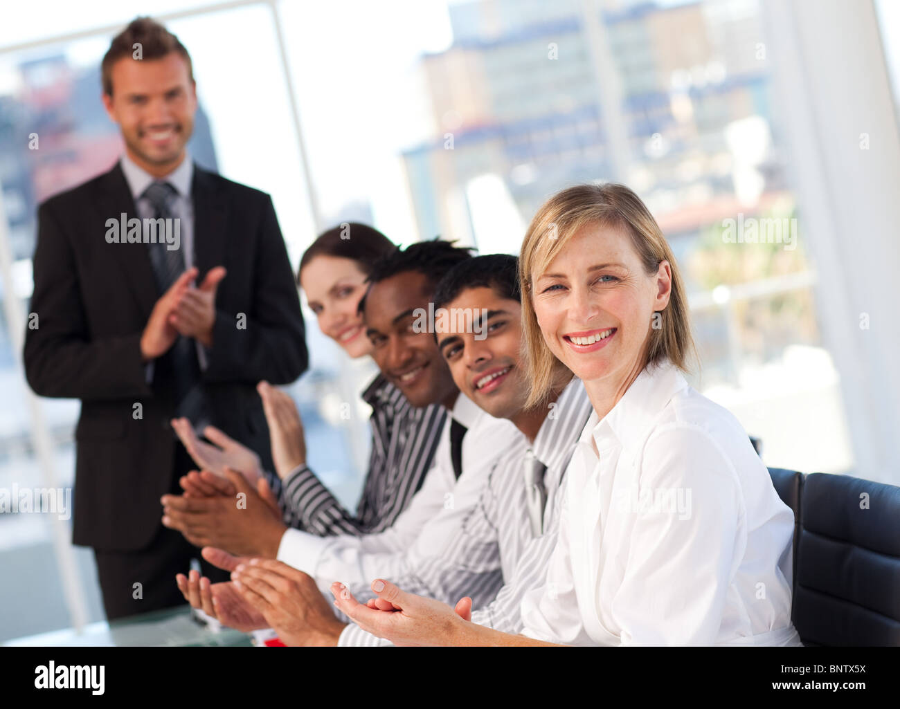 Senior businesswoman clapping after a presentation Stock Photo - Alamy