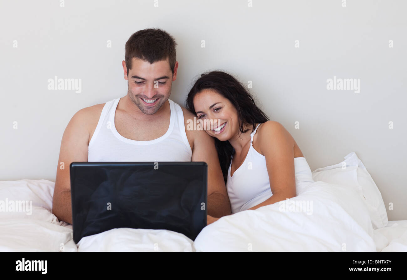 Laptop bed couple bright hi-res stock photography and images - Alamy