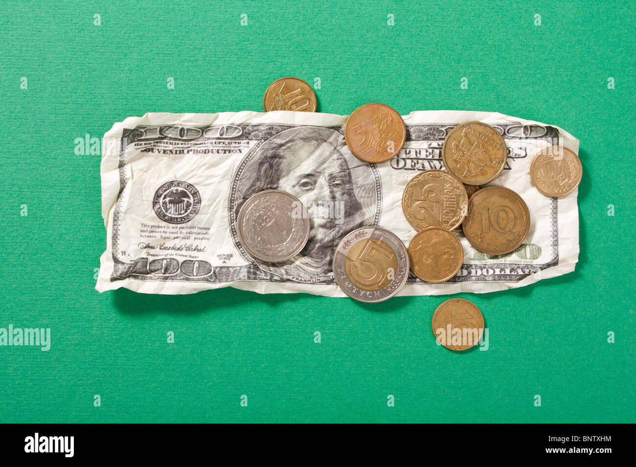 Dollars and coins Stock Photo - Alamy