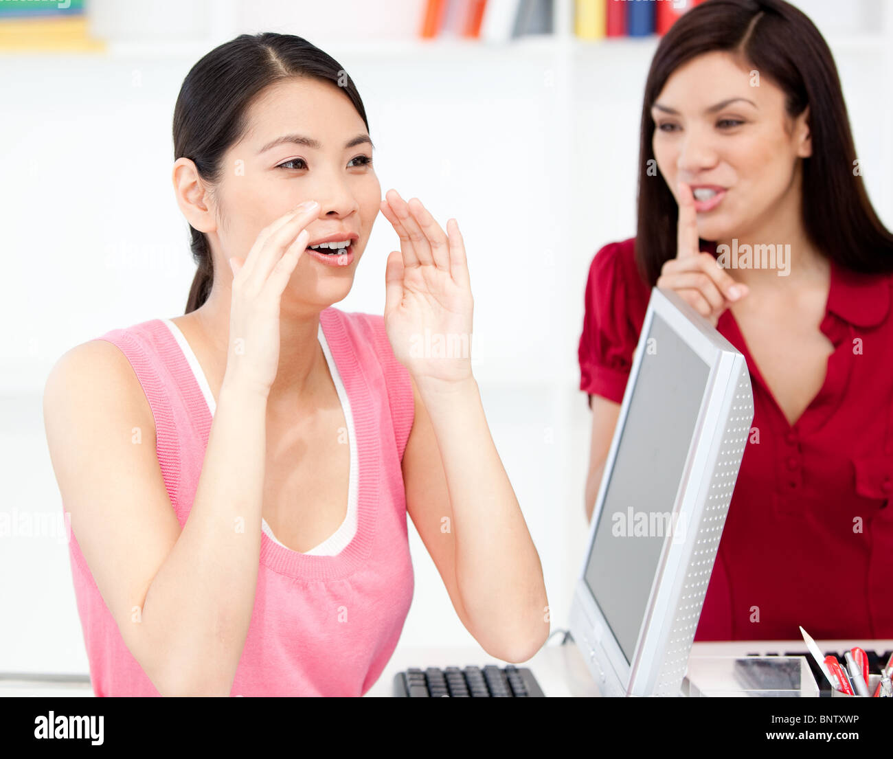 Businesswoman asking for silence while her colleague shouting Stock ...