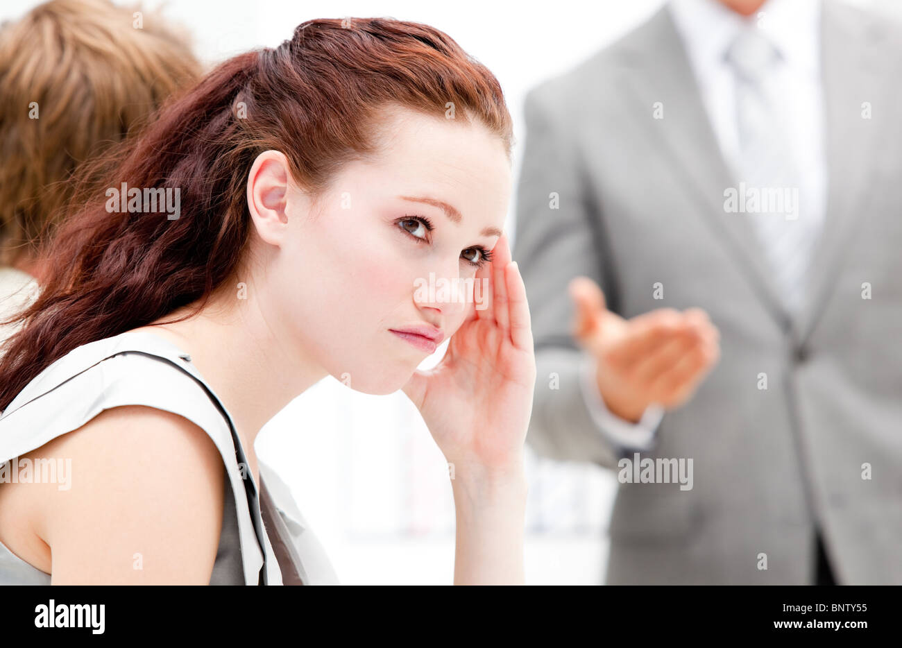 Portrait of a thinking businesswoman during a meeting Stock Photo - Alamy