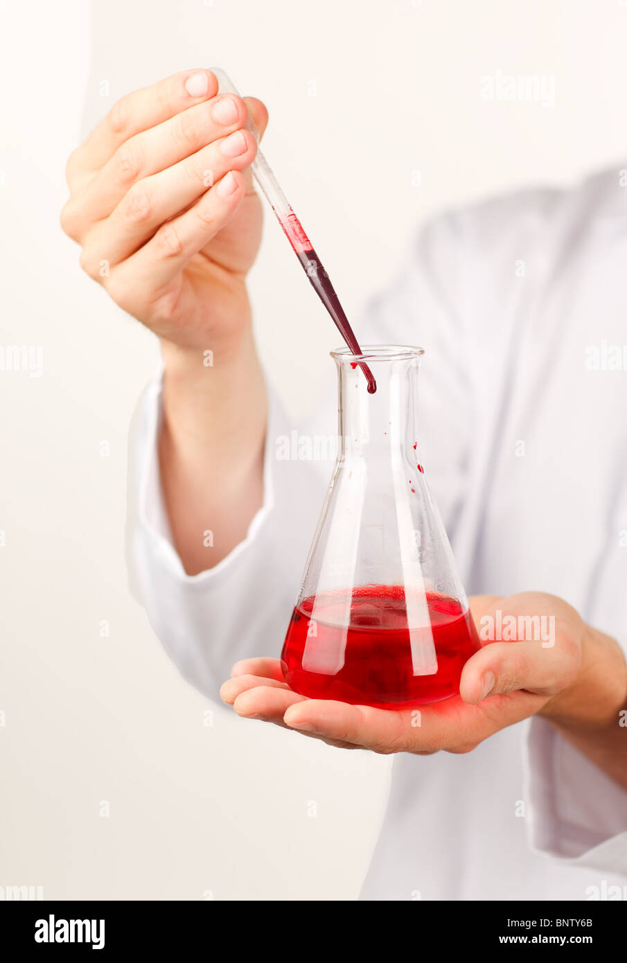 Orange and white test tube liquid hi-res stock photography and images ...