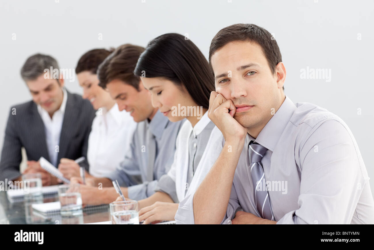 Bored businessman in a meeting Stock Photo - Alamy