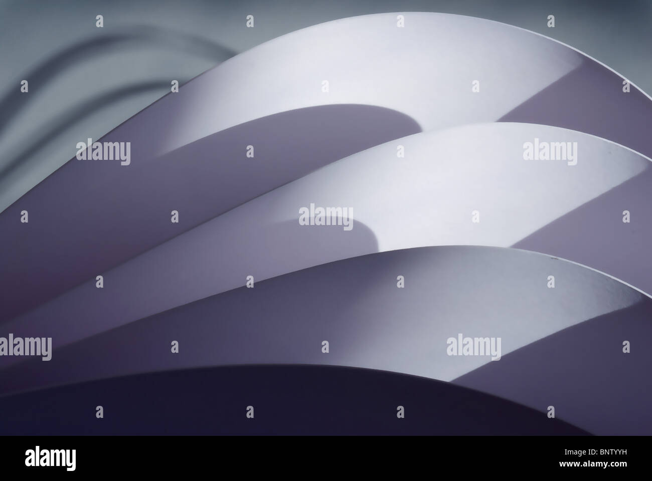 Curved shapes of sheets of card/paper Stock Photo - Alamy