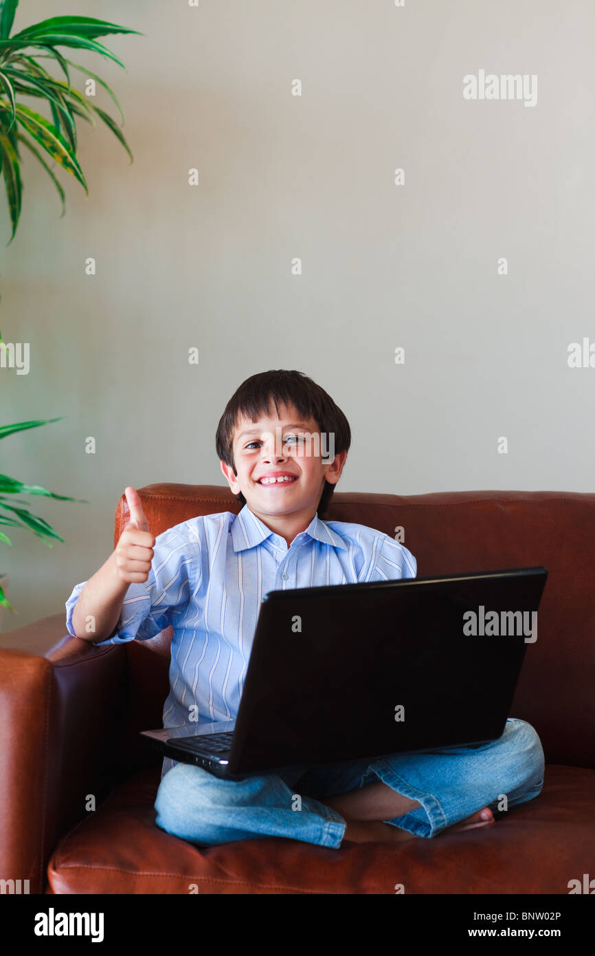 Kid using laptop thumb hi-res stock photography and images - Alamy