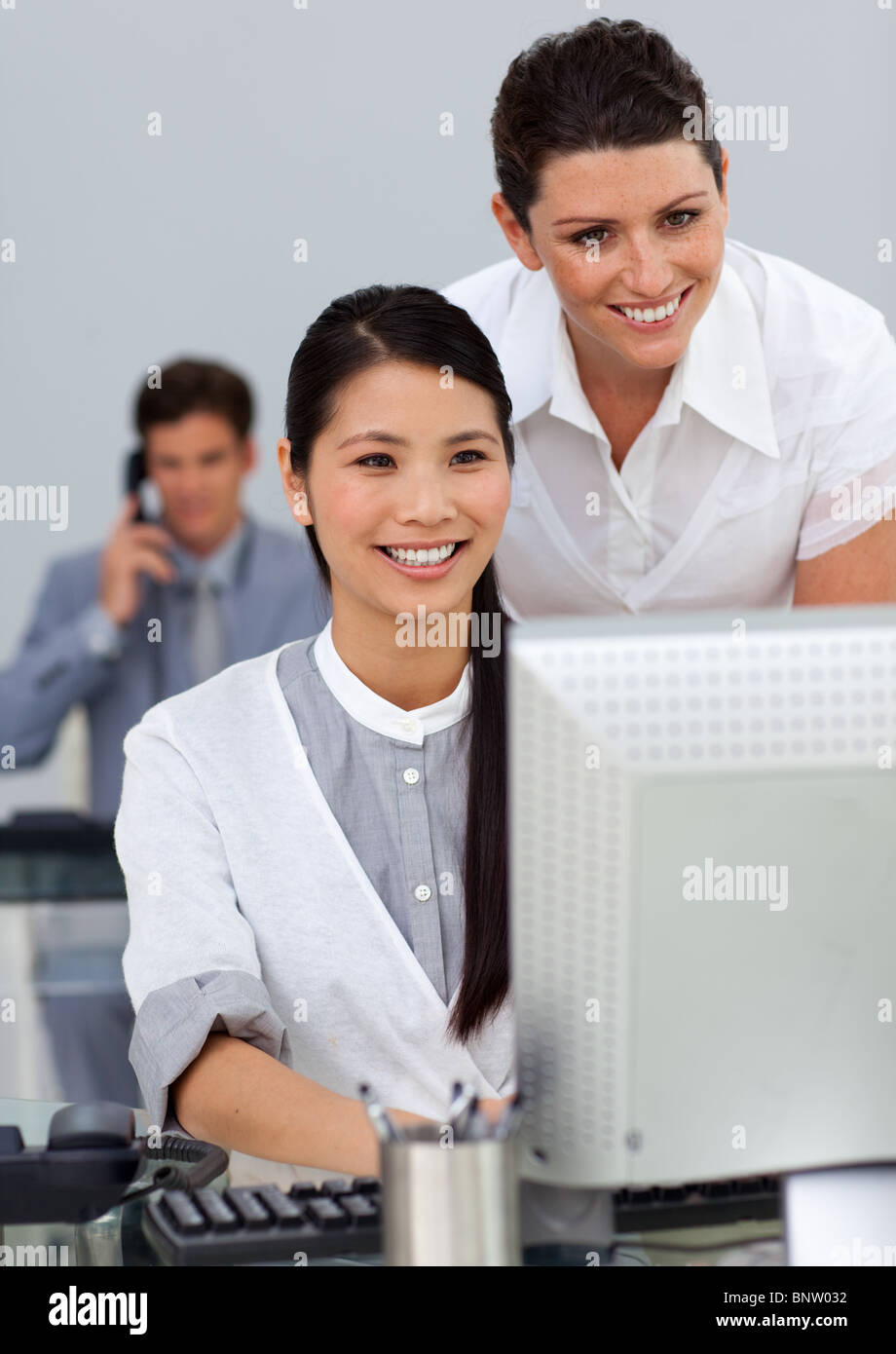 Attractive manager checking her employee's work Stock Photo - Alamy