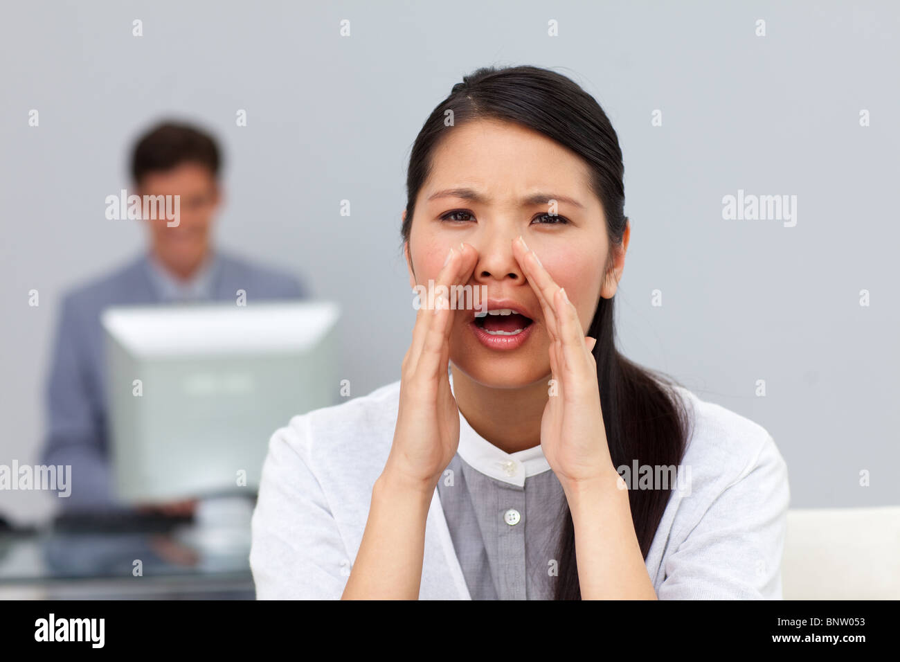 Angry businesswoman shouting in the office Stock Photo - Alamy