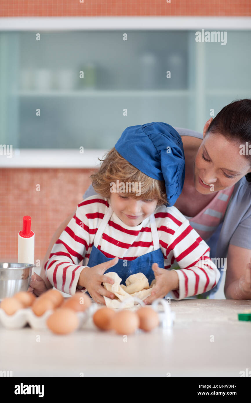 Bright mother and her son baking at home Stock Photo - Alamy