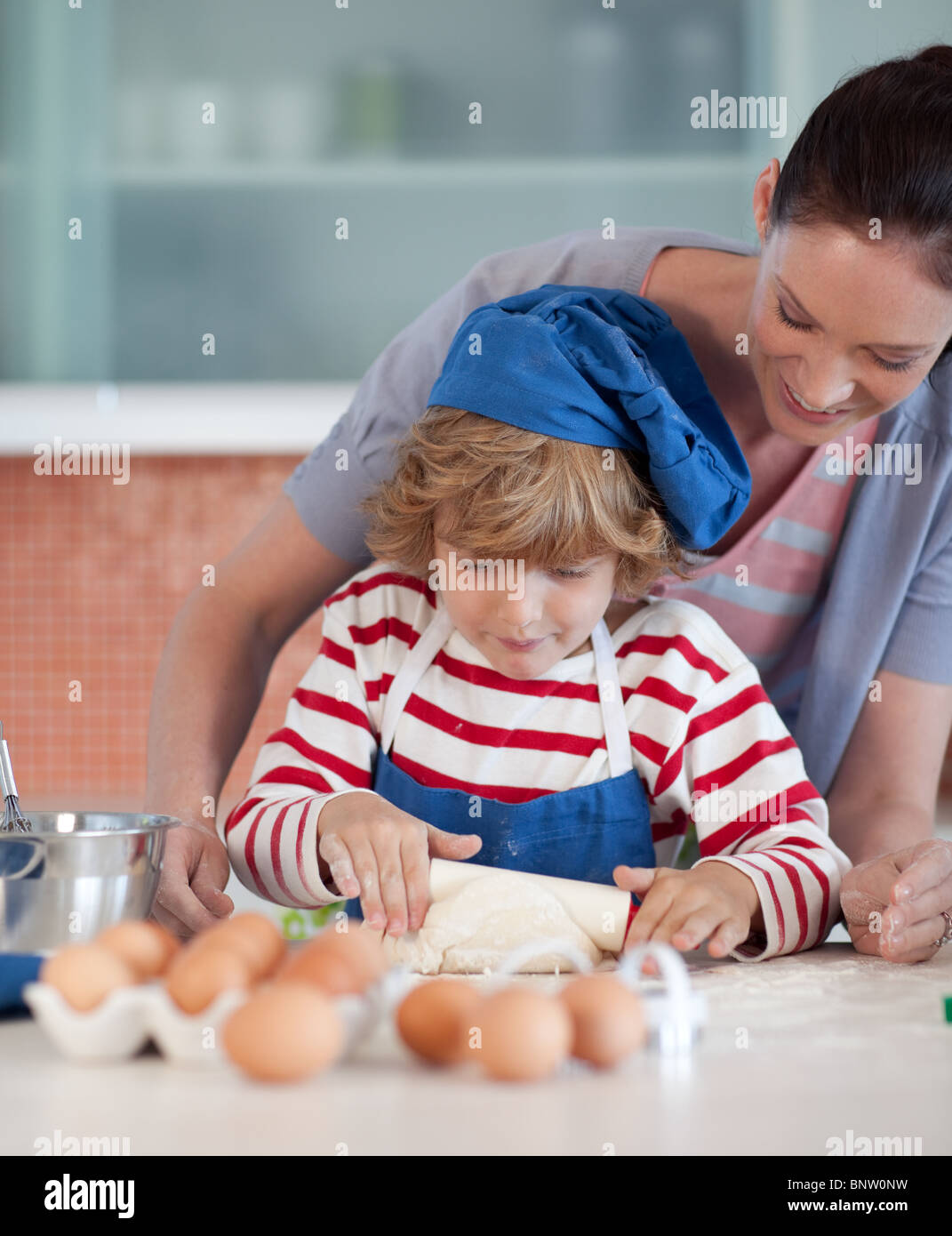 Delighted mother and her son baking at home Stock Photo - Alamy