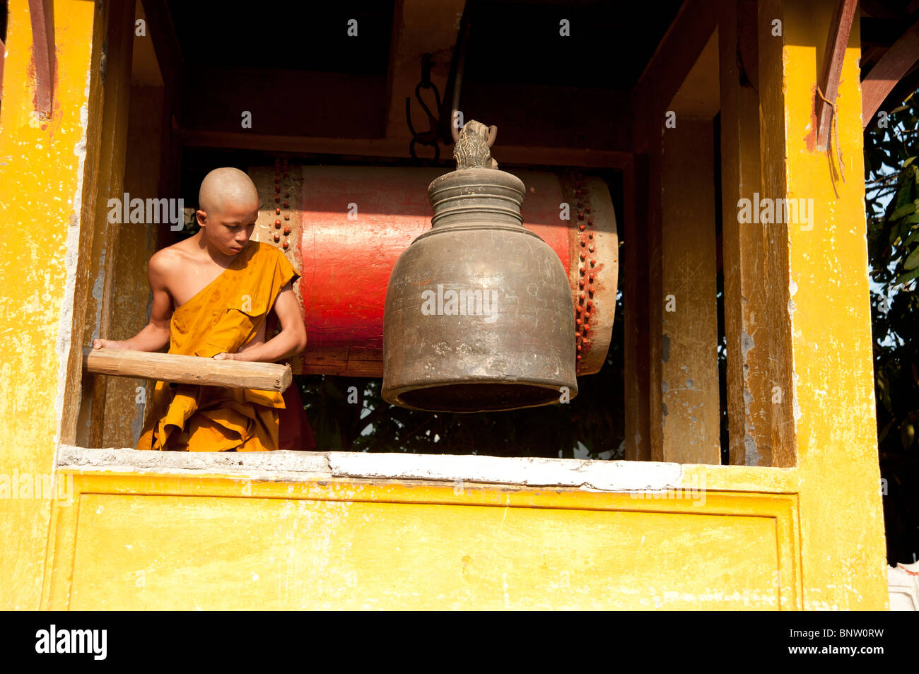 Lao novice monk rings temple bell hi-res stock photography and images ...