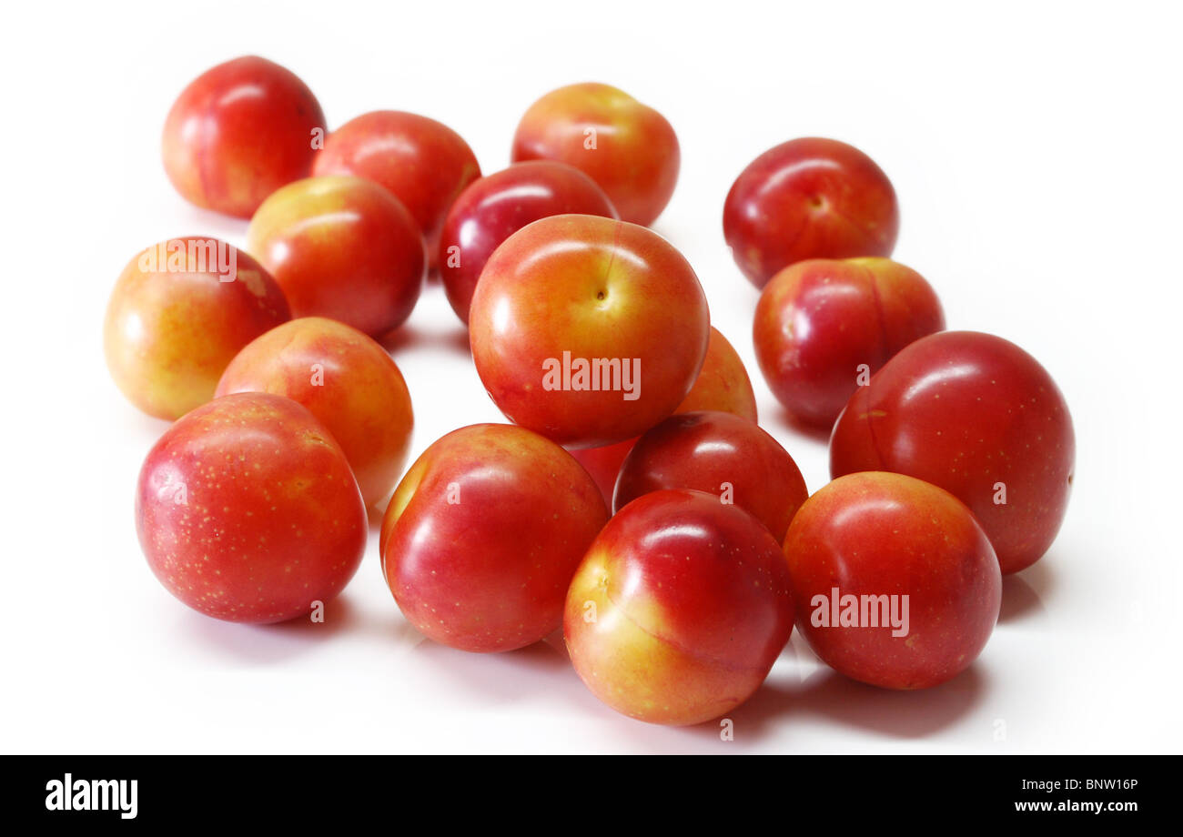 Cherry plums on white background Stock Photo - Alamy