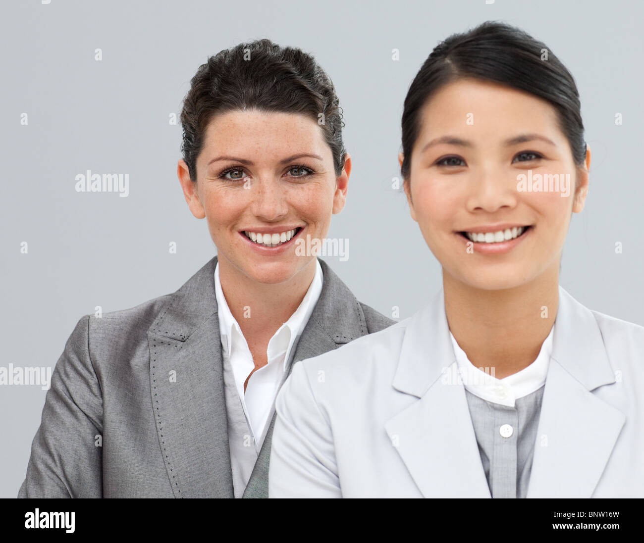 Happy business associates in a row Stock Photo - Alamy