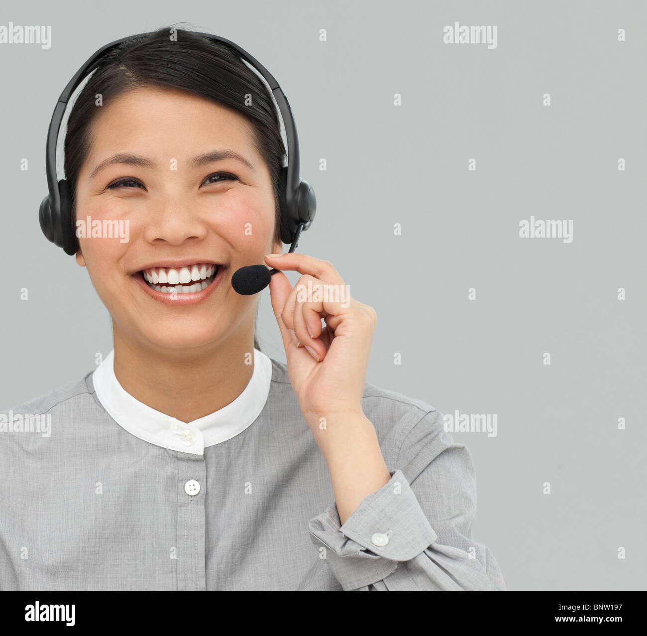 Customer service agent with headset on Stock Photo - Alamy