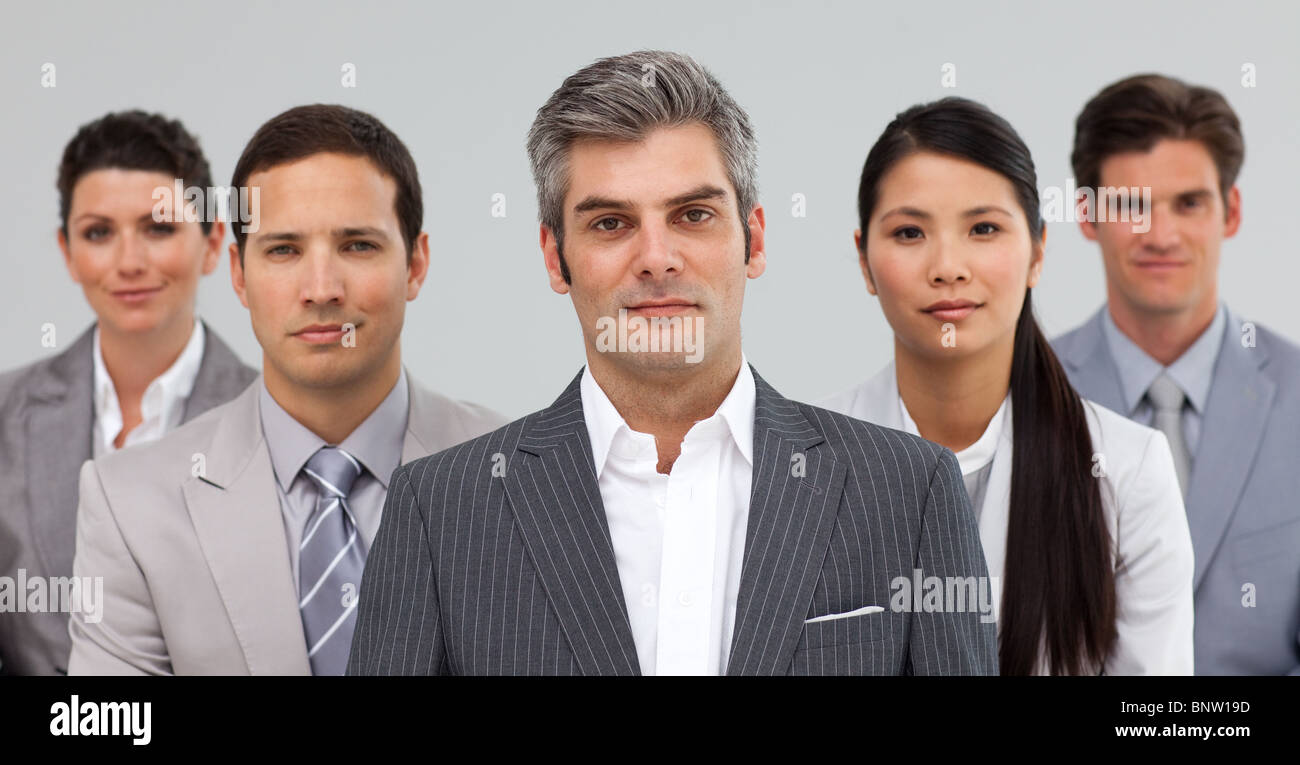 Serious busines people standing together Stock Photo - Alamy