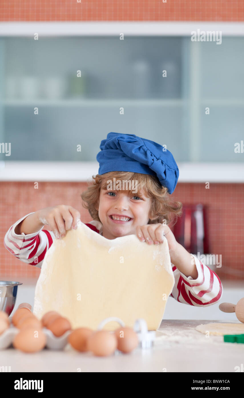 Young boy baking in a kitchen Stock Photo - Alamy