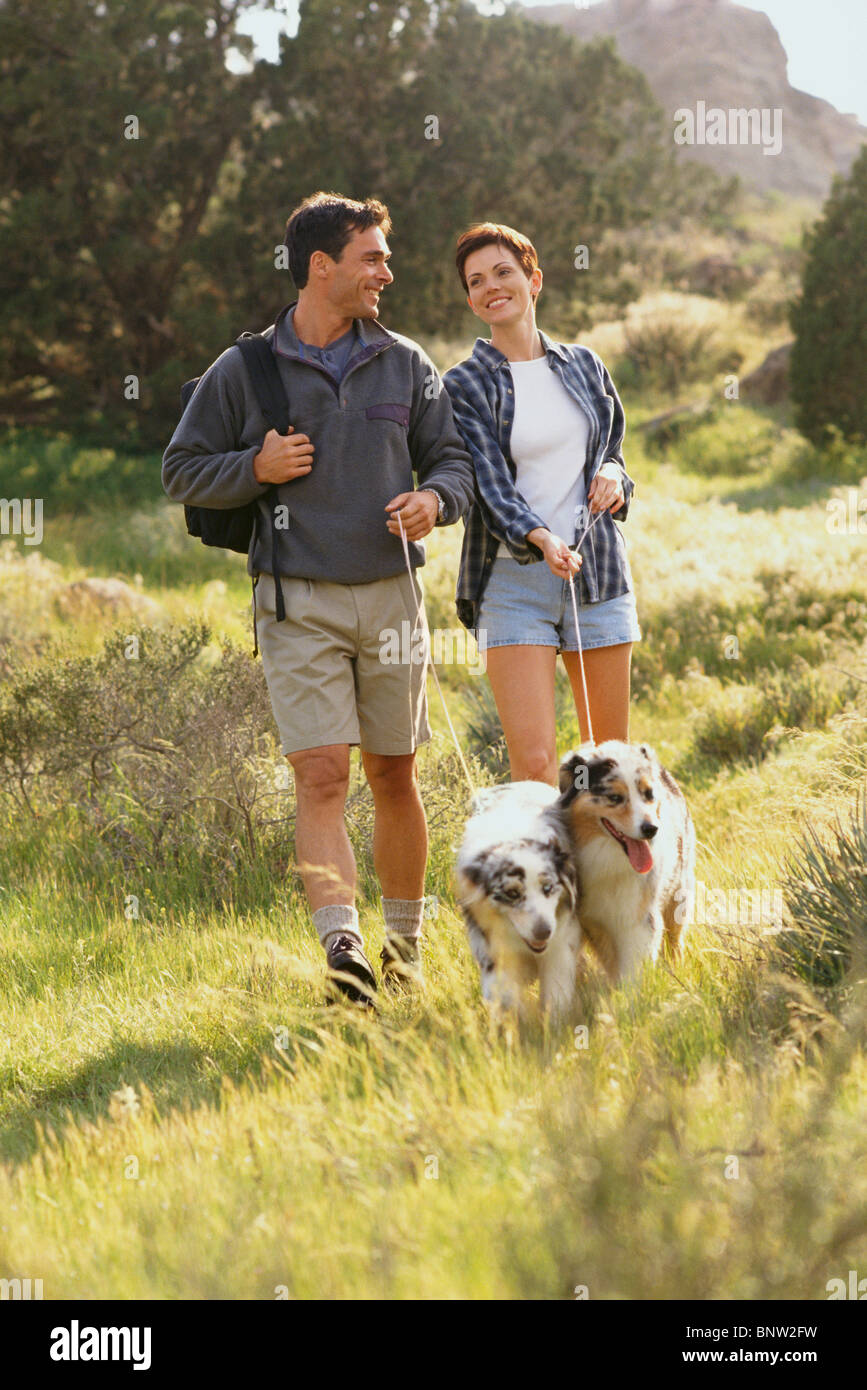 40s couple walking dog hi-res stock photography and images - Alamy