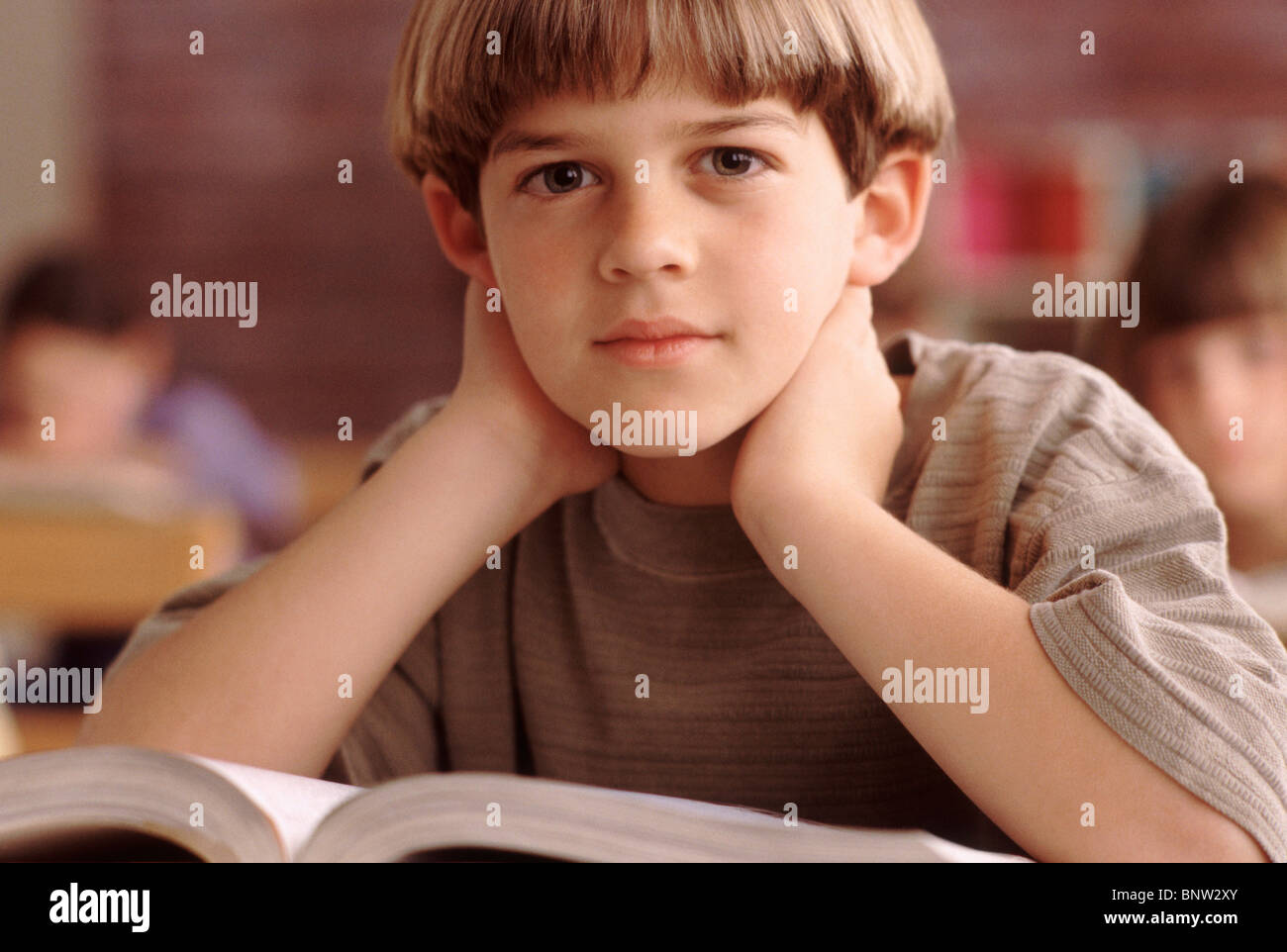 Elementary school student sitting at his desk Stock Photo - Alamy