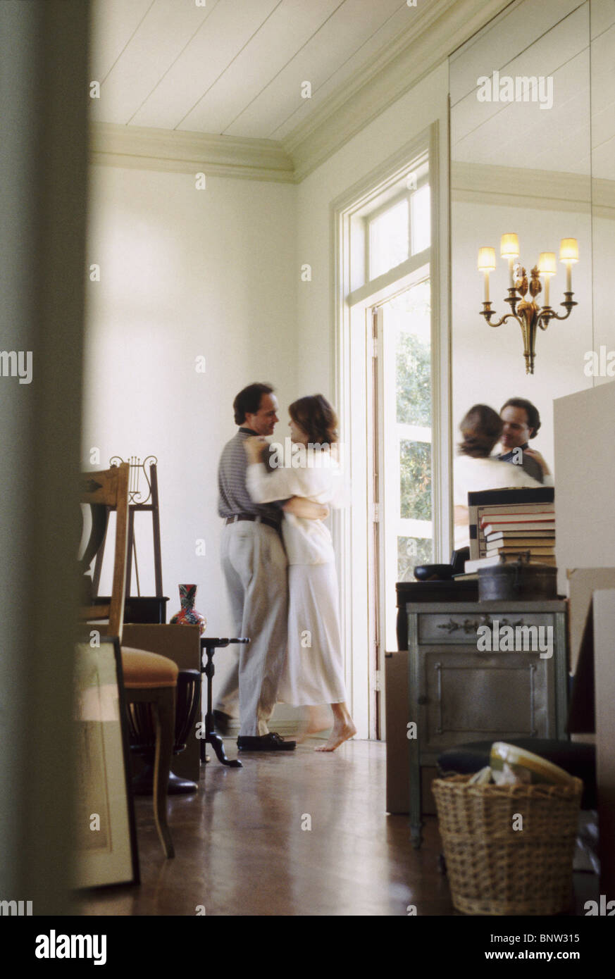Couple dancing in their home Stock Photo - Alamy