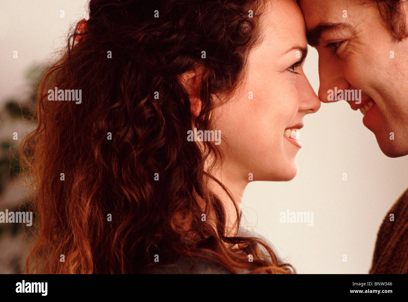 Couple with their foreheads together Stock Photo - Alamy