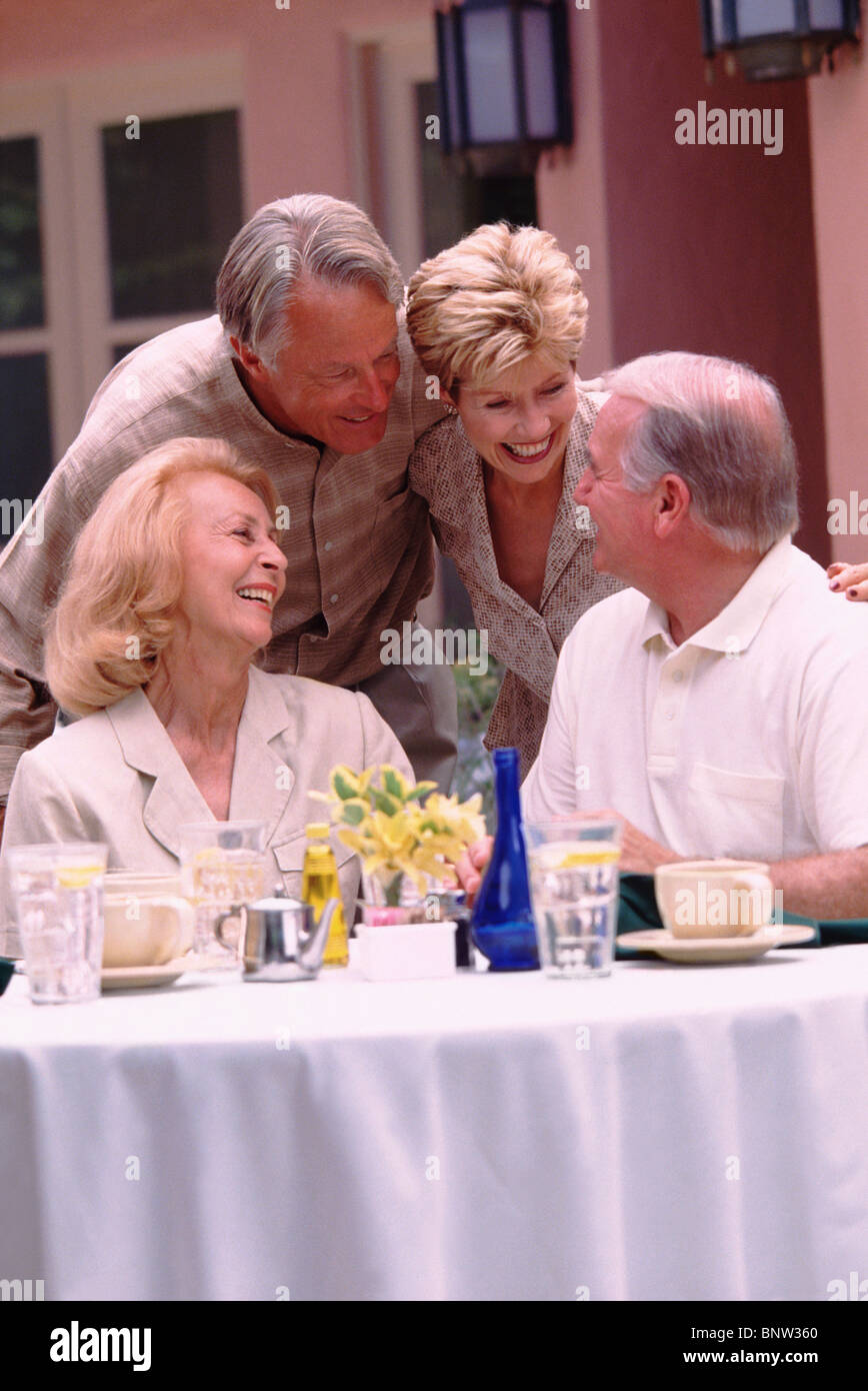 Two mature couples dining outdoor hi-res stock photography and images ...
