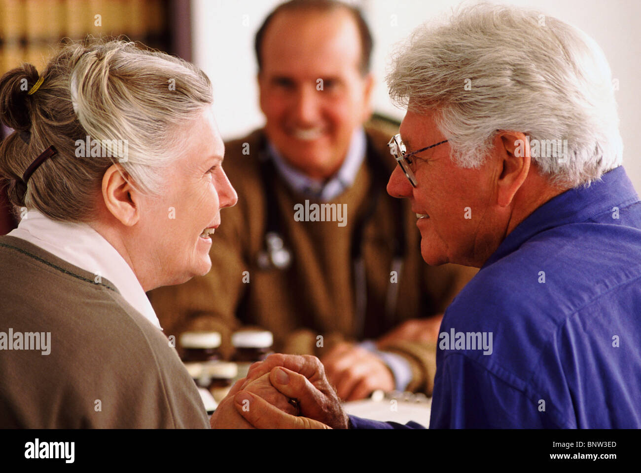 Doctor sitting across desk hi-res stock photography and images - Alamy