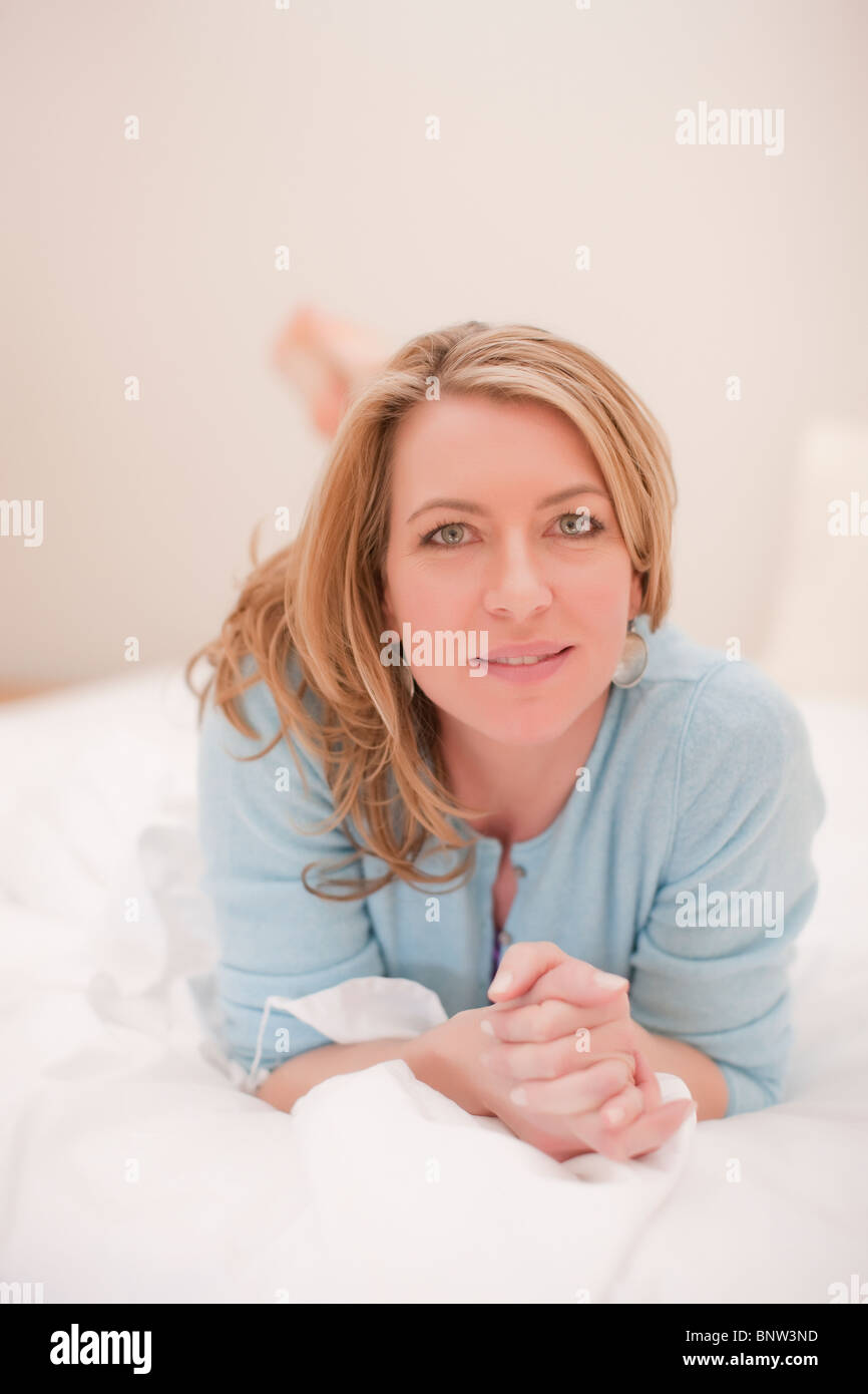 Relaxed woman lying down Stock Photo - Alamy