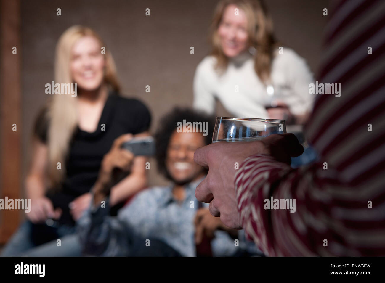 Group of people socializing at a party Stock Photo - Alamy