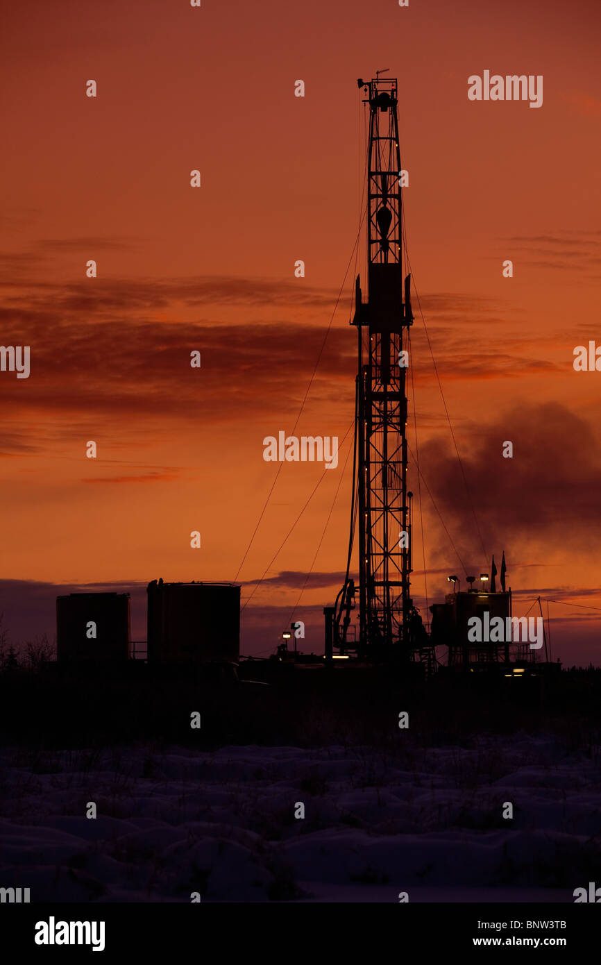 Oil drilling rig at dusk Stock Photo - Alamy
