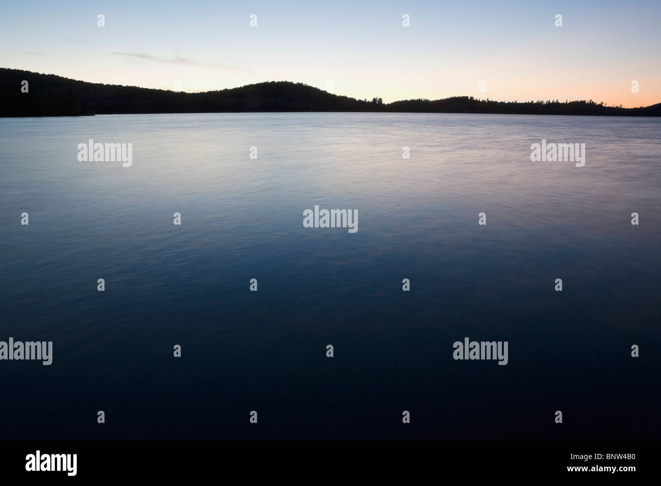Lake at twilight Stock Photo - Alamy