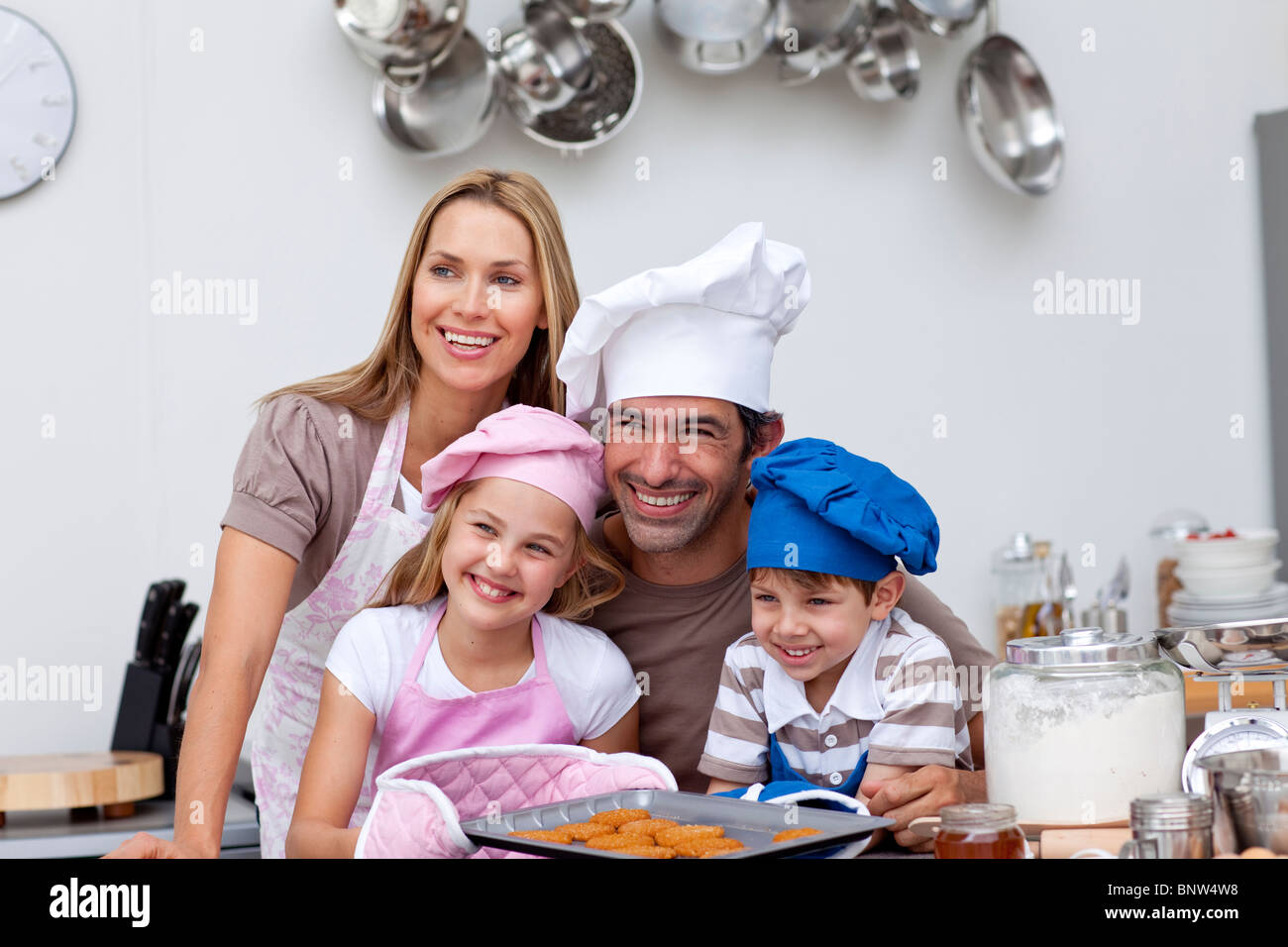 Happy family baking in the kitchen Stock Photo - Alamy