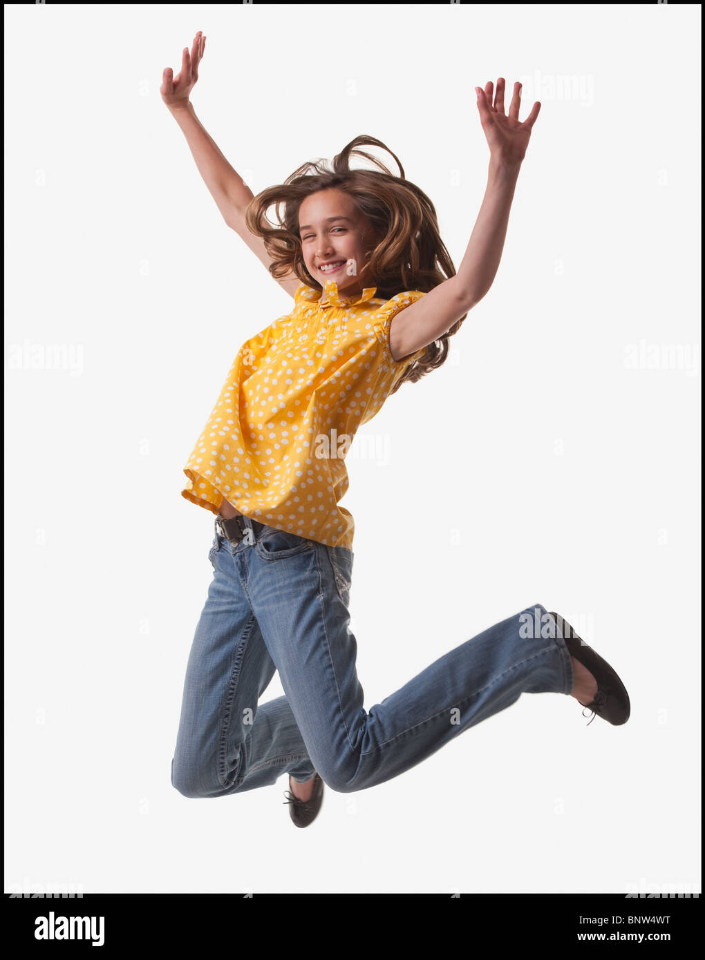 Excited teenage girl jumping for joy Stock Photo - Alamy