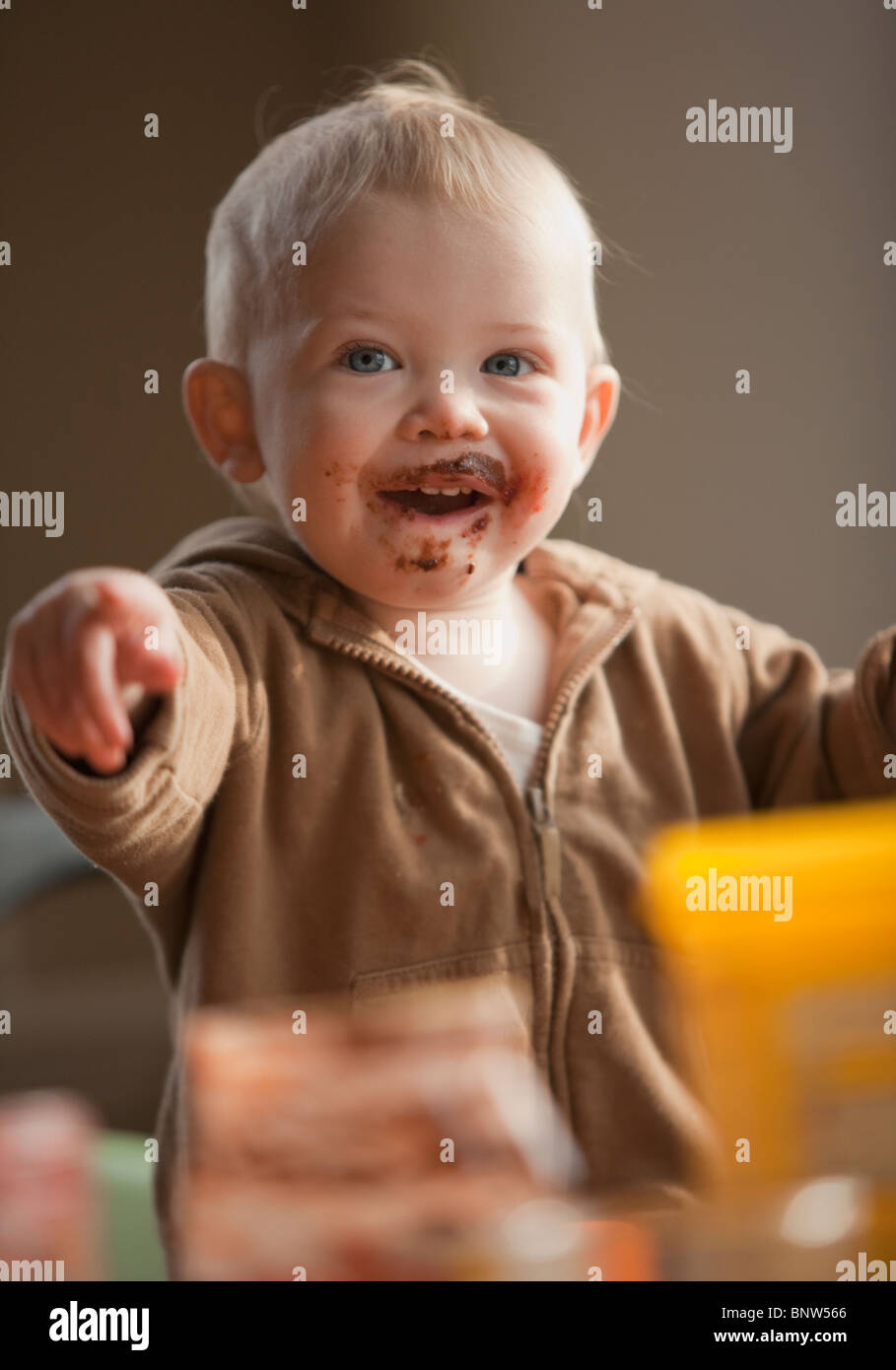 Baby with messy face Stock Photo - Alamy