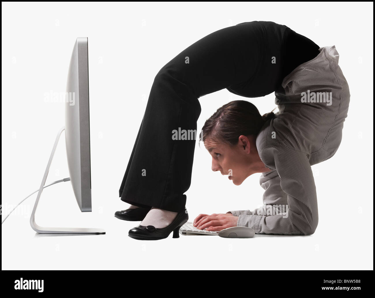 Businesswoman bending over backwards Stock Photo - Alamy