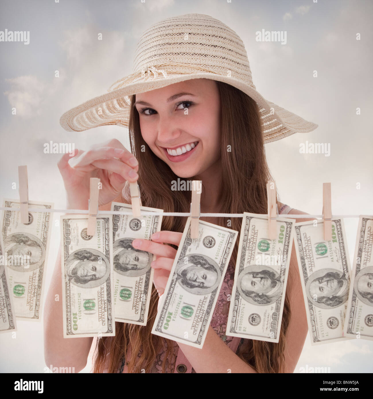Woman hanging money out dry hi-res stock photography and images - Alamy