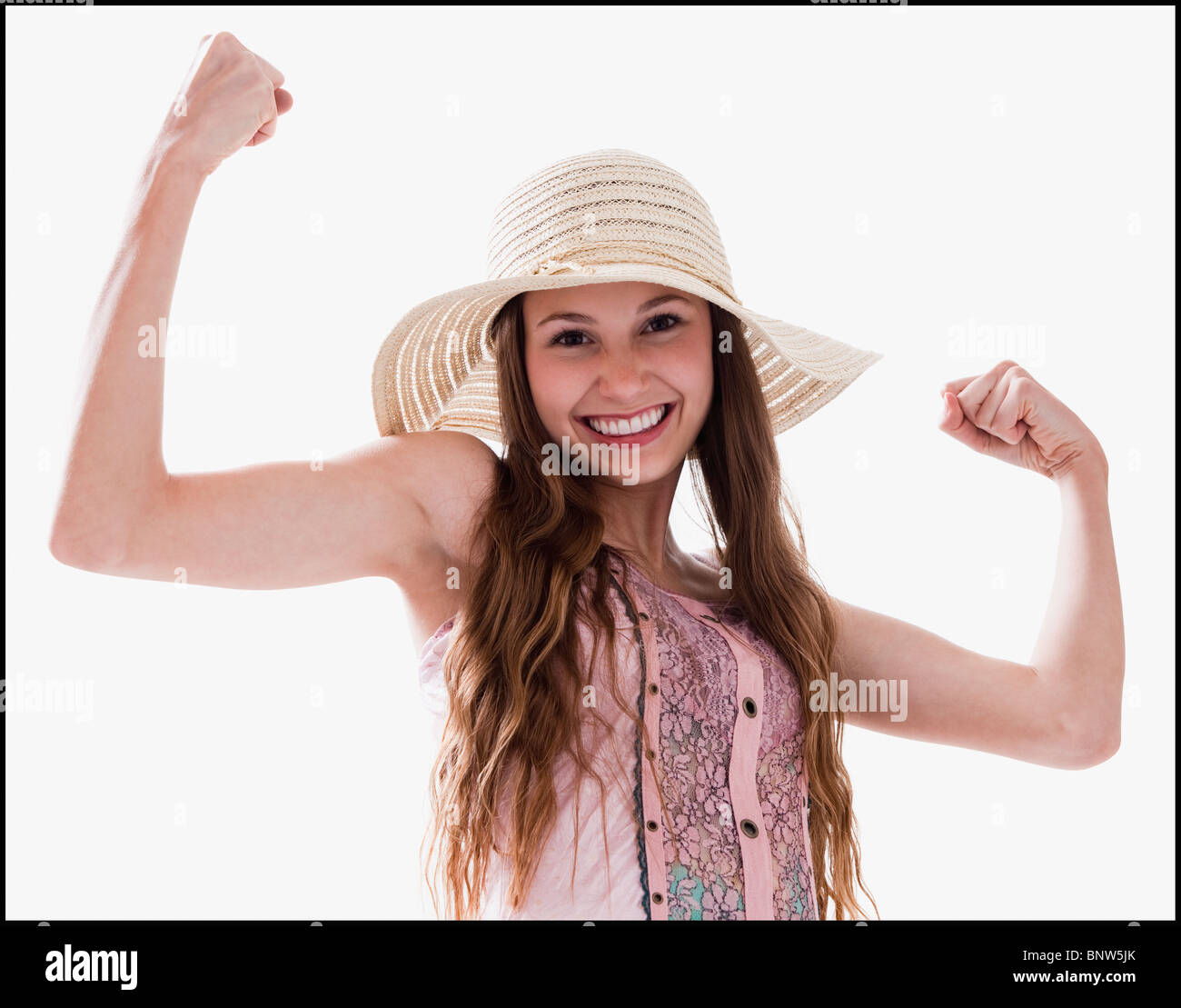 Smiling woman flexing her muscles Stock Photo - Alamy