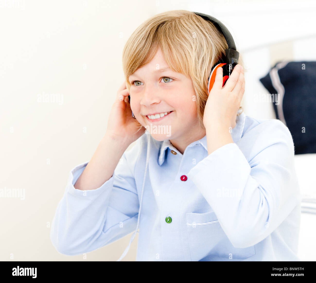 Adorable boy listenning music Stock Photo - Alamy