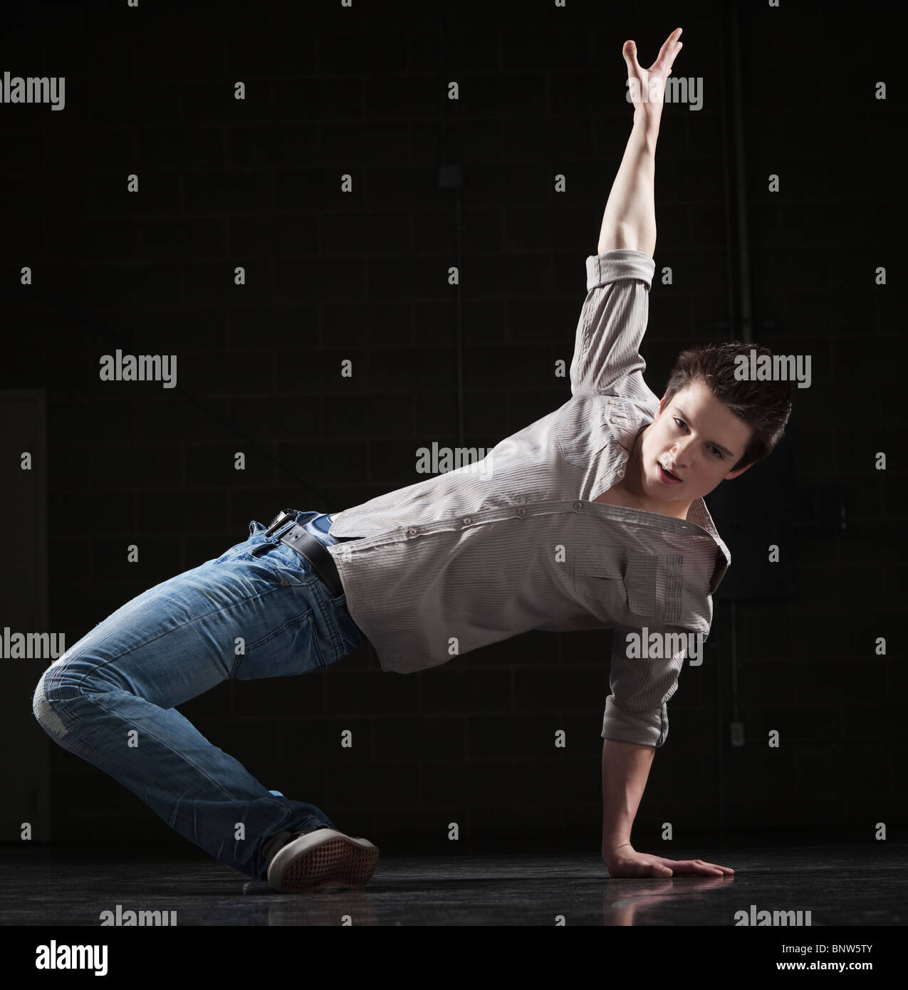Male dancer balancing on one arm Stock Photo - Alamy