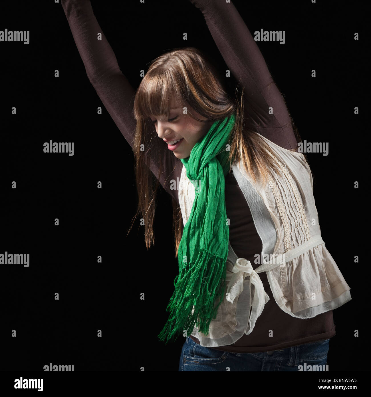 Female dancer with her arms raised above her head Stock Photo - Alamy